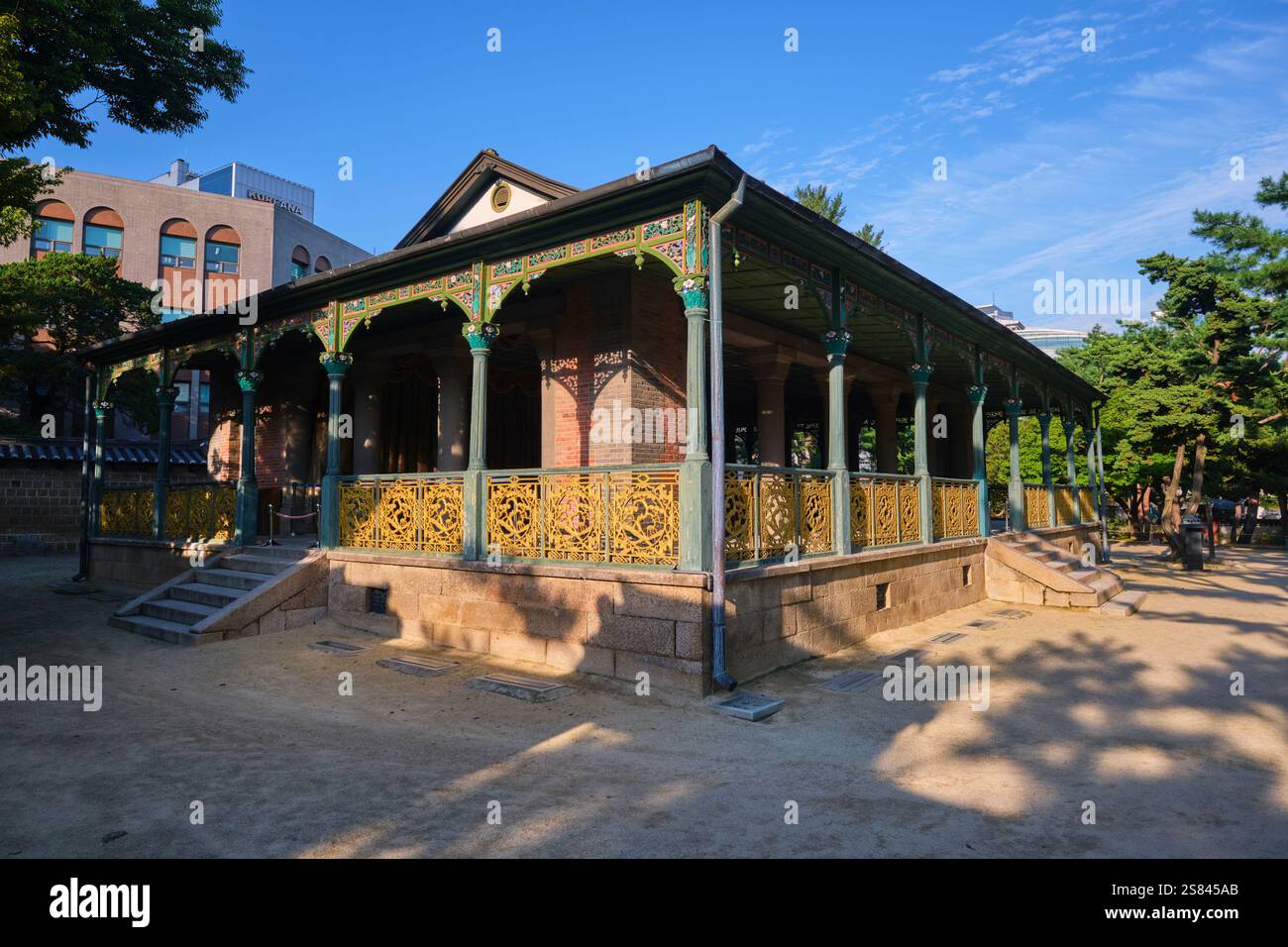View of the ornate, gold, cast iron front porch of the Victorian era ...