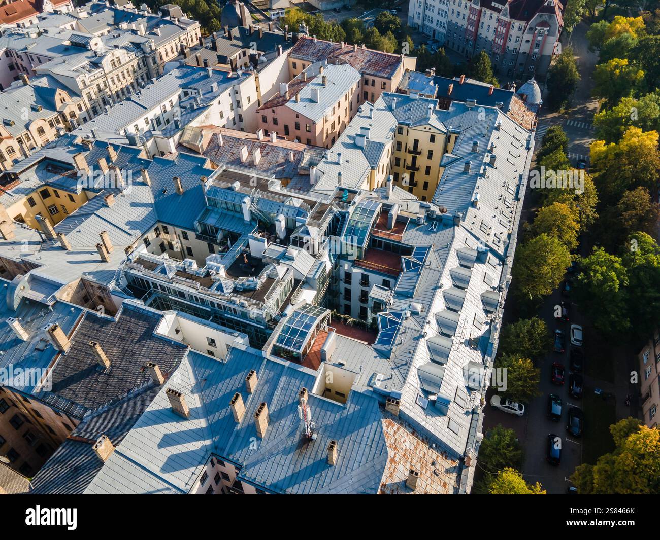Compact urban layout with historic buildings, light colored roofs ...