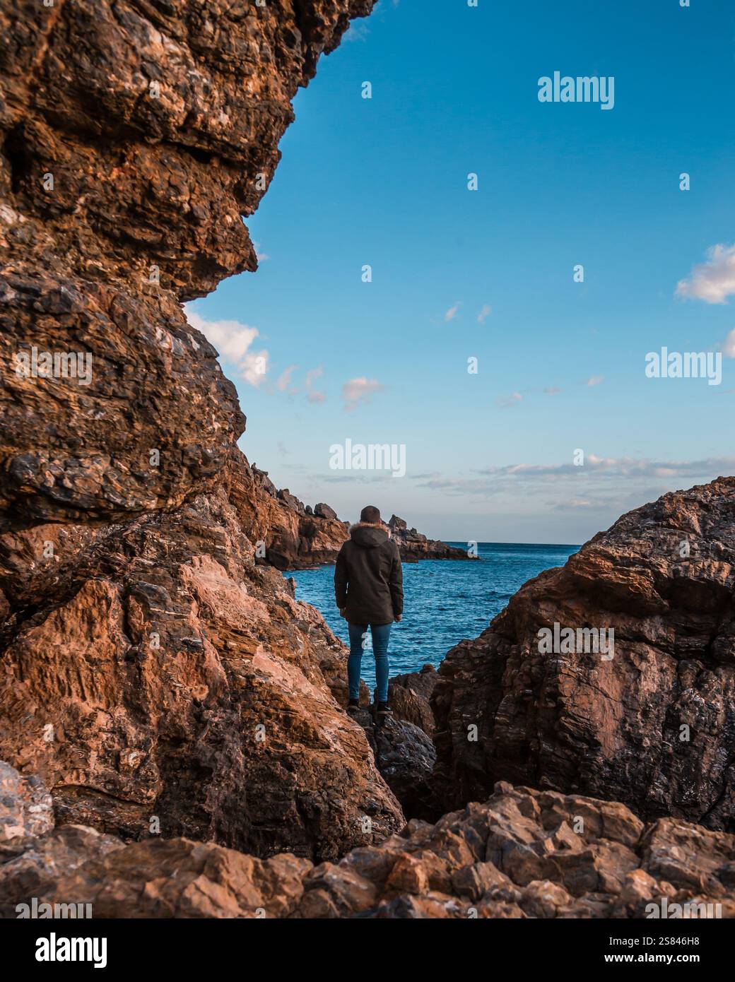 Stands on jagged coastal rocks hi-res stock photography and images - Alamy