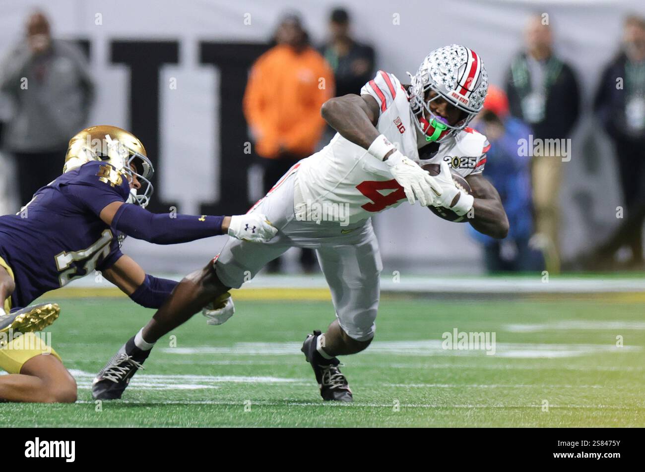 Ohio State wide receiver Jeremiah Smith (4) is pulled down by Notre ...