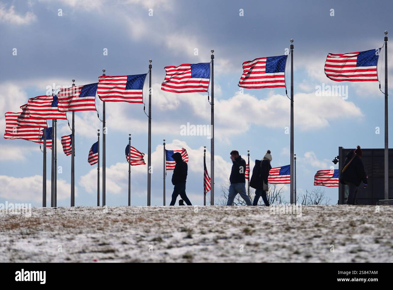 U.S. flags around the Washington Monument are at full staff during the ...