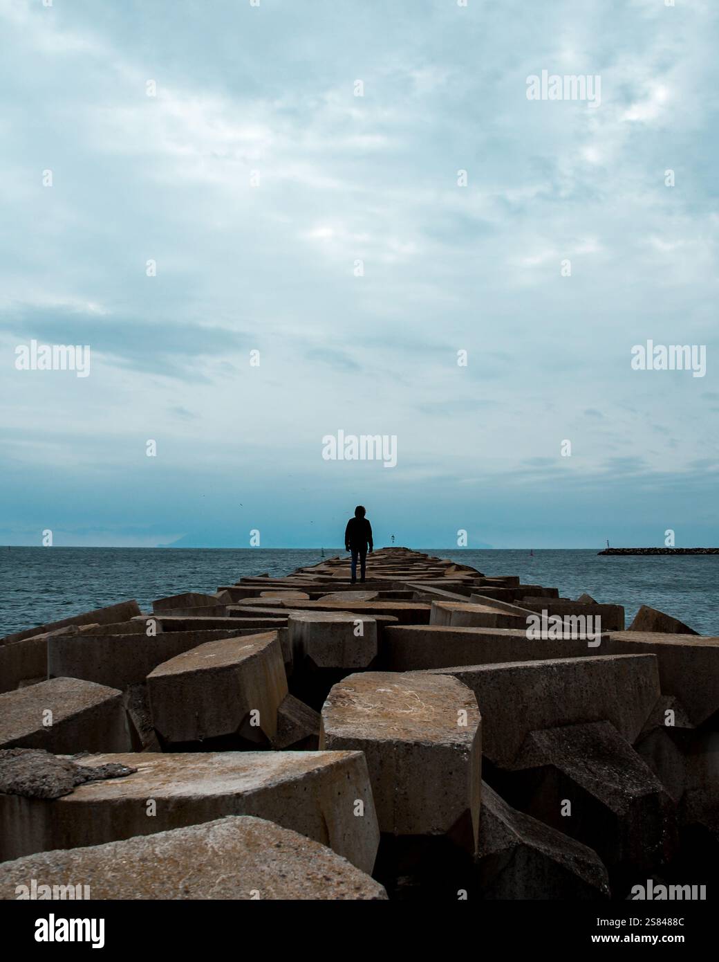 Contemplative figure stands in hi-res stock photography and images - Alamy