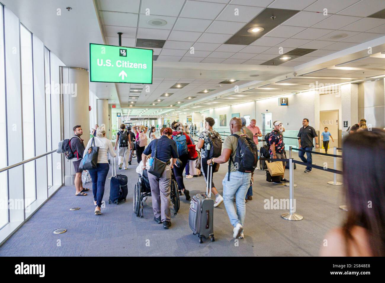 Walking toward immigration area hi-res stock photography and images - Alamy