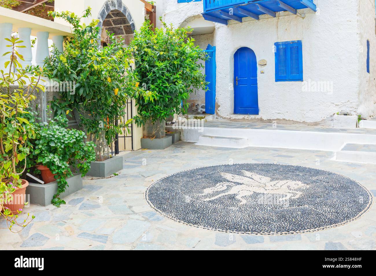 Traditional pebble mosaic adorning Mandraki old town, Mandraki, Nisyros ...