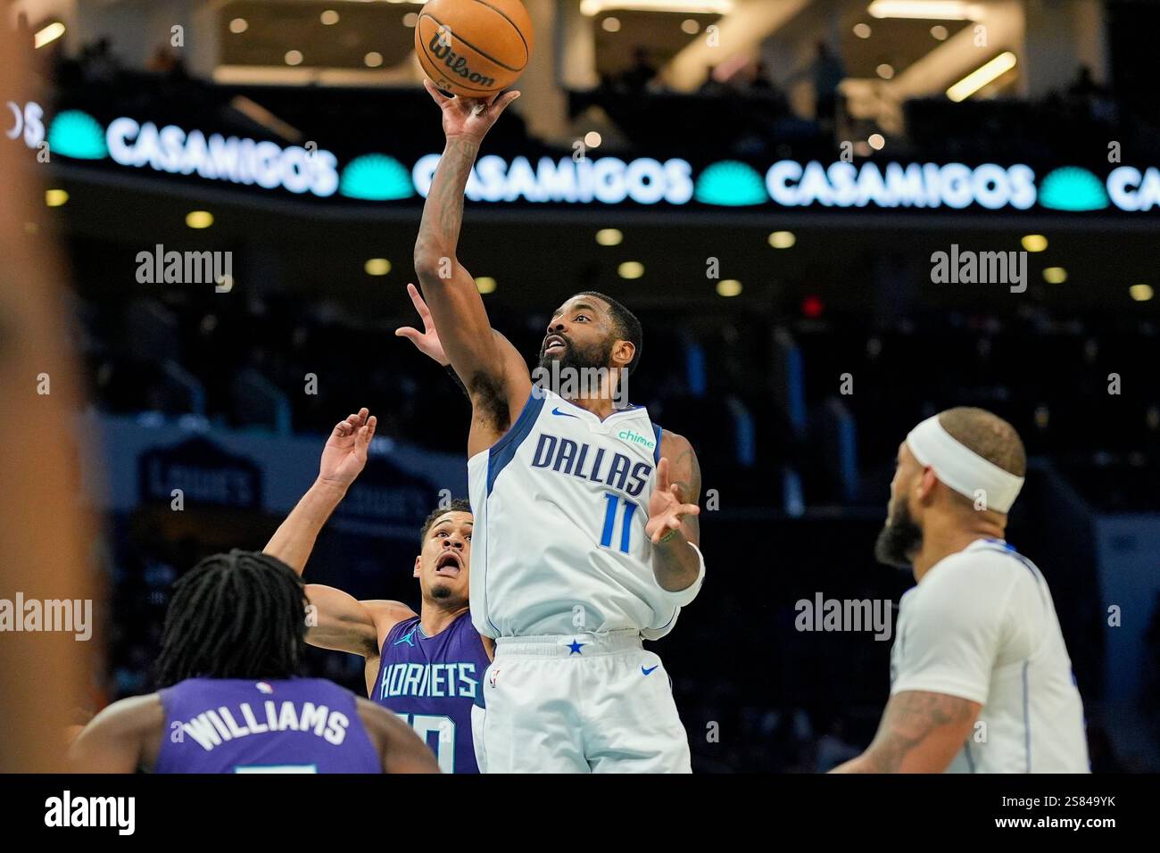 Dallas Mavericks guard Kyrie Irving (11) takes a jump shot against the ...