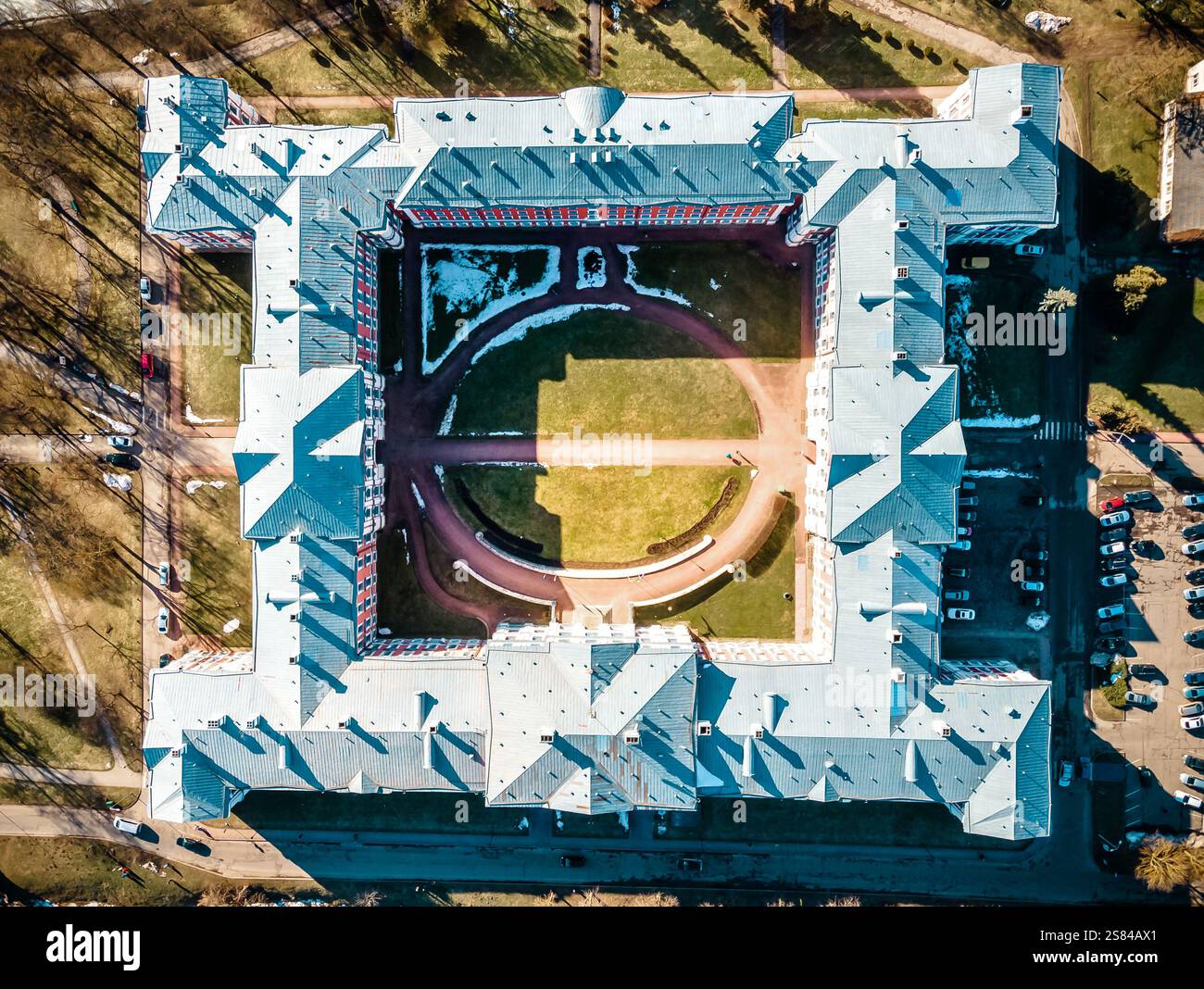 Aerial perspective of a large rectangular building with a central ...