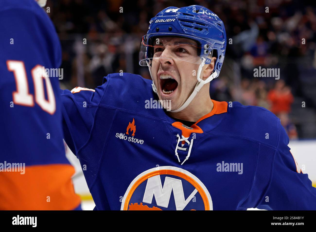 New York Islanders center Jean-Gabriel Pageau reacts after Simon ...