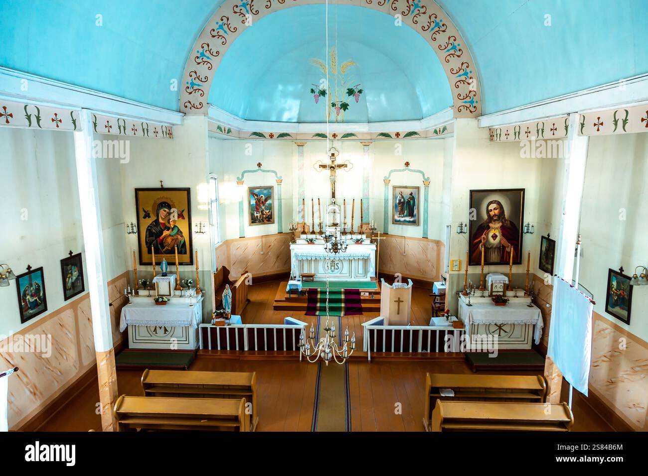Light blue arched ceiling with floral patterns, central altar with ...