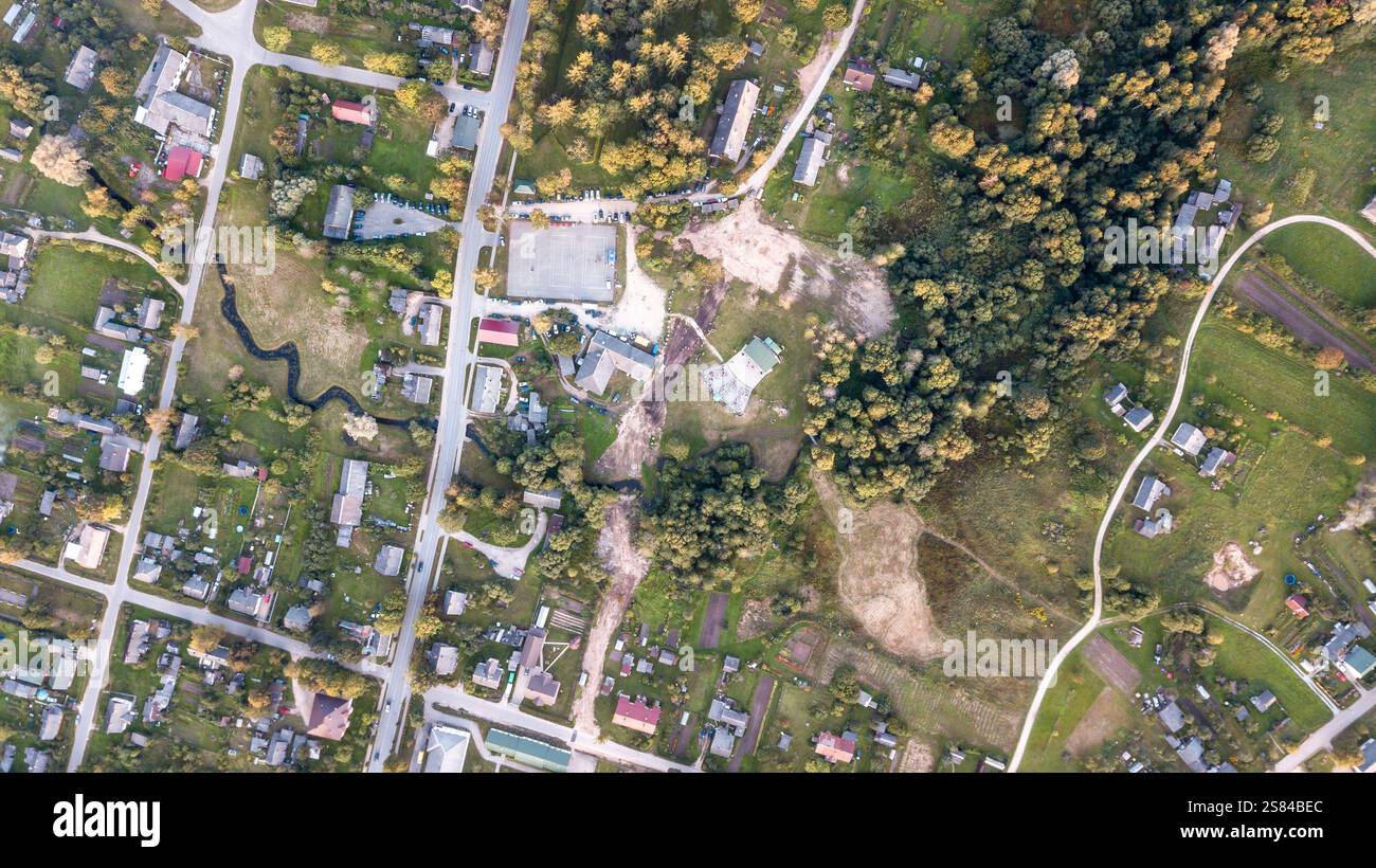 Aerial perspective of a small town featuring residential buildings, a ...