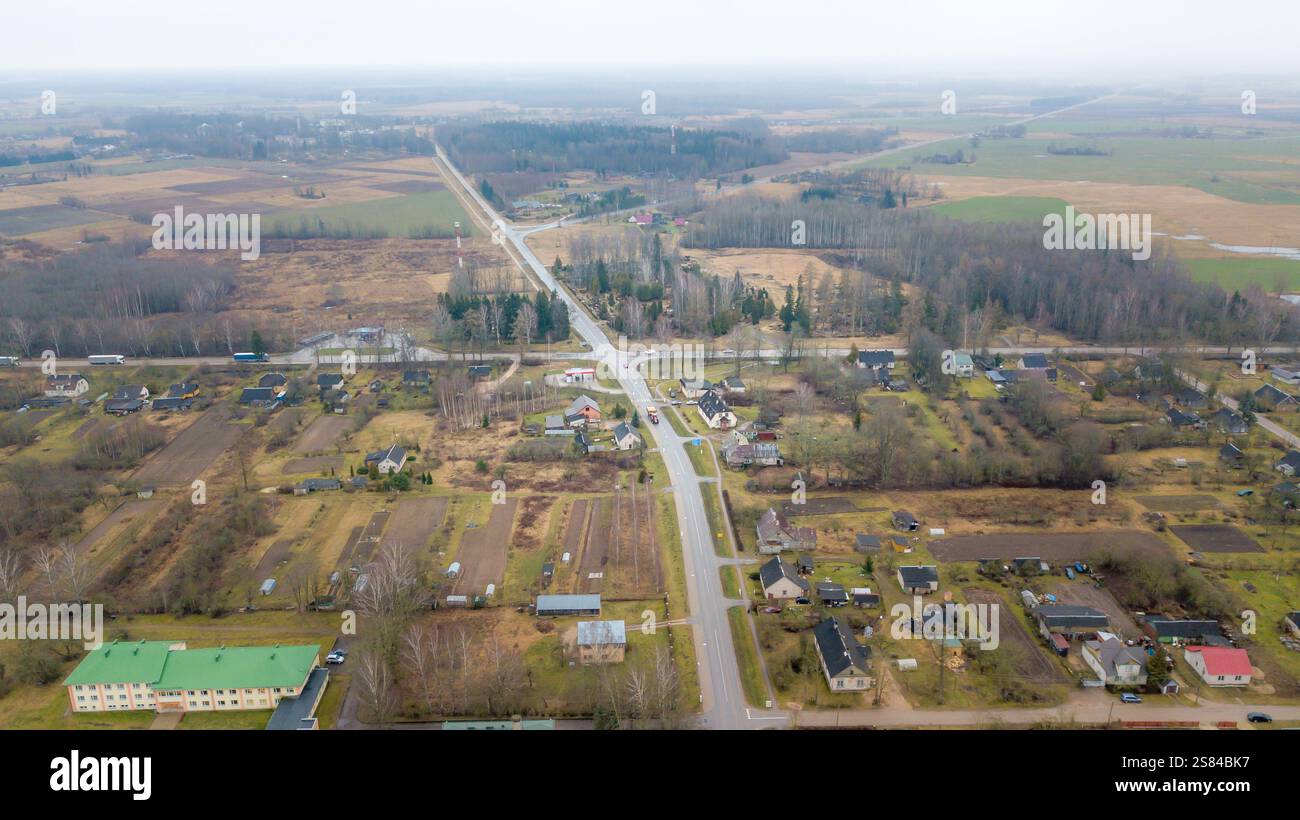 Aerial perspective of a rural village featuring intersecting roads ...