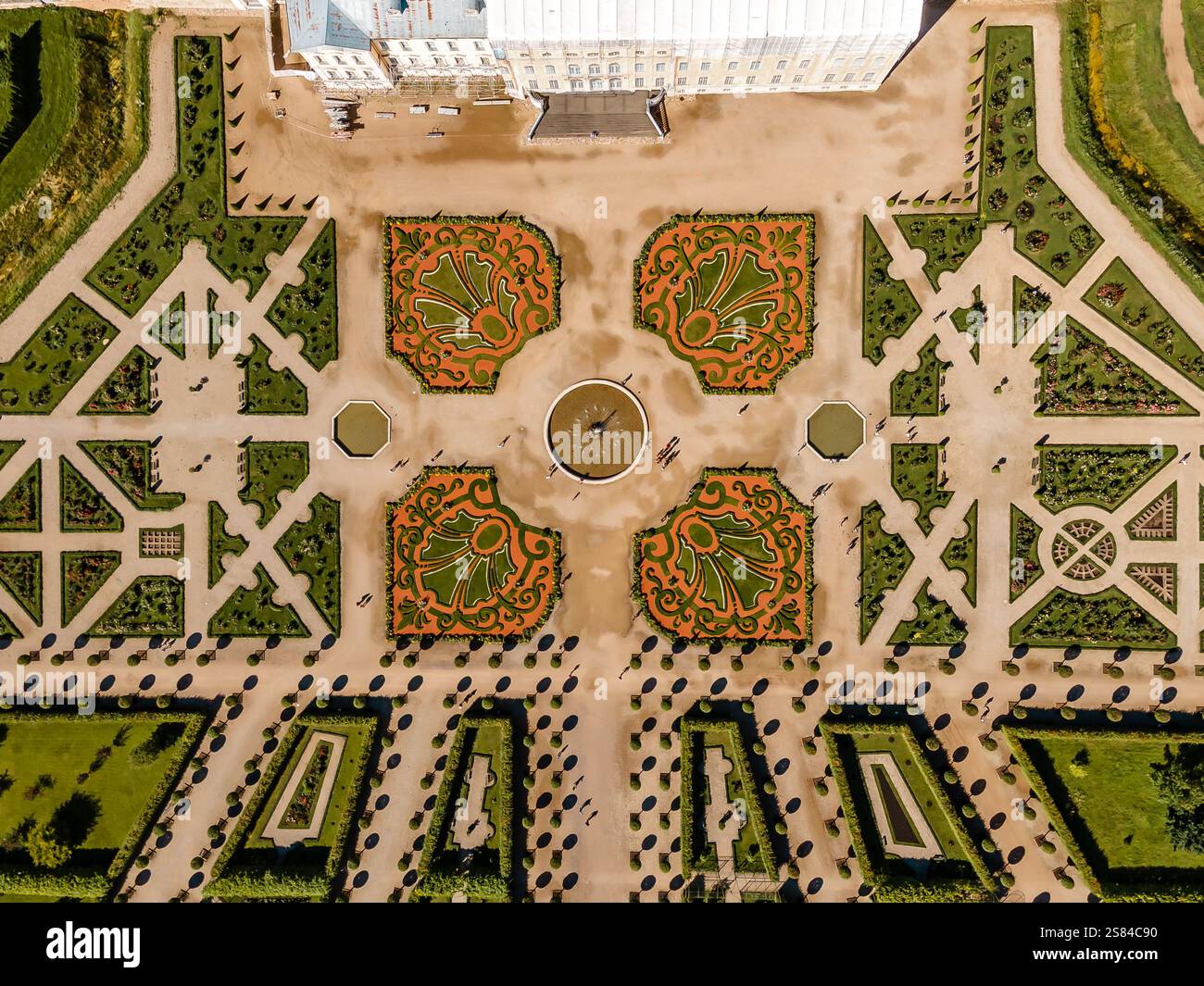 Aerial view of a formal garden featuring geometric pathways, a central ...