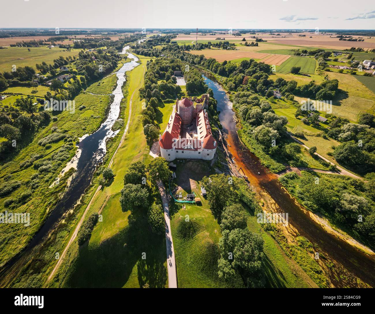 Aerial perspective of a historic castle with red rooftops and white ...