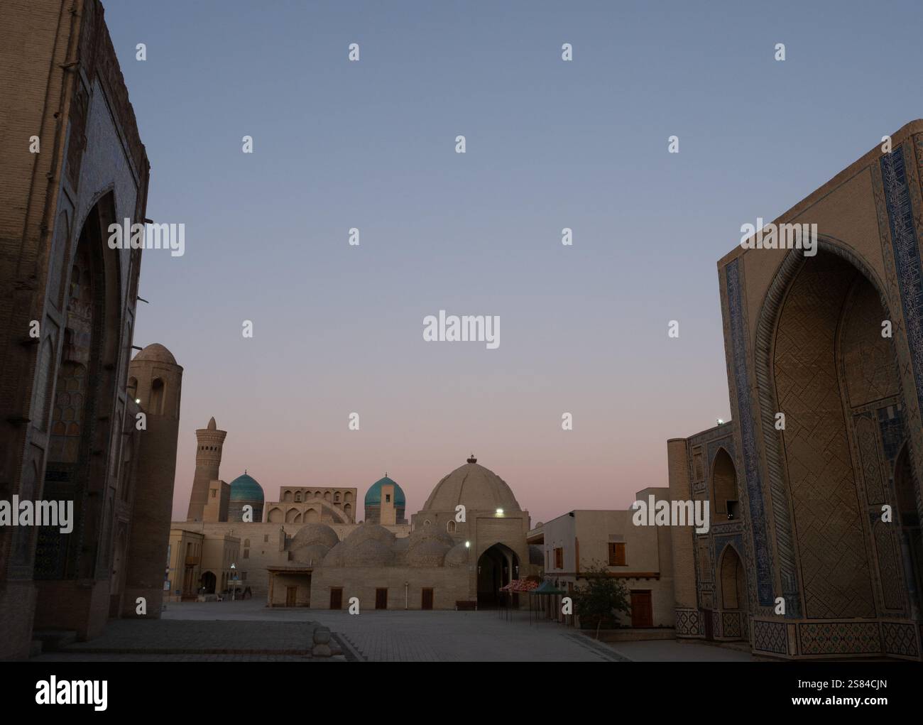 Old City of Bukhara with domes and minaret of Kalan Mosque in the ...