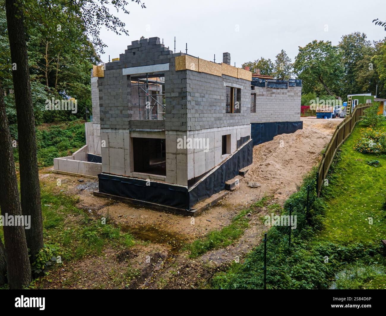 Concrete and cinder block structure with scaffolding and unfinished ...