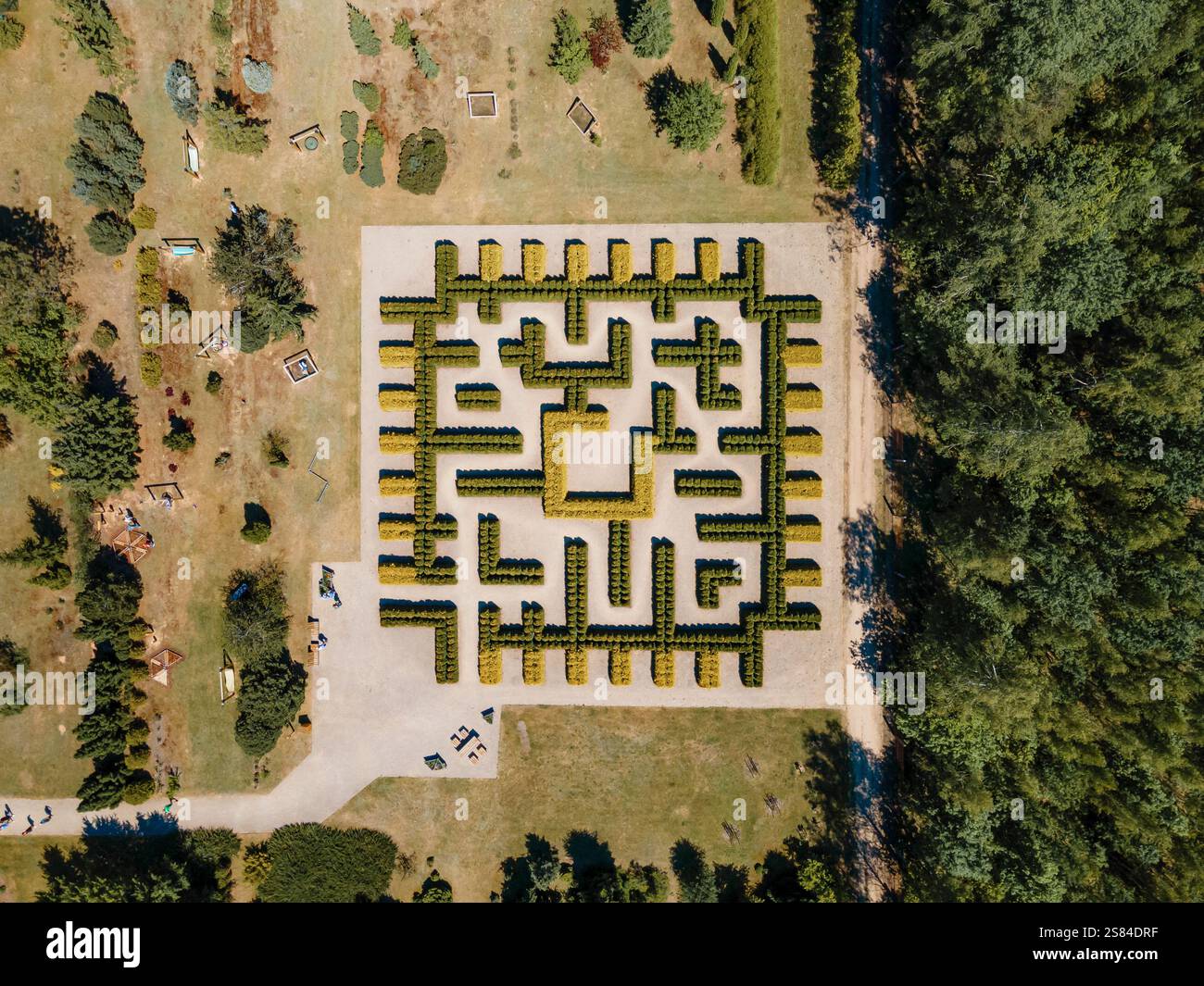 Aerial perspective of a square hedge maze in a landscaped park ...