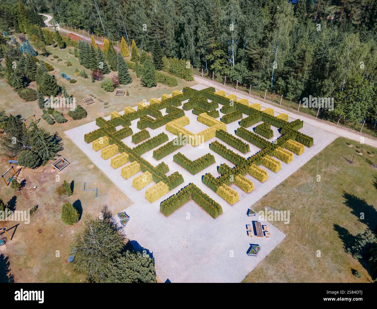 Aerial perspective of a hedge maze with intricate patterns, surrounded ...