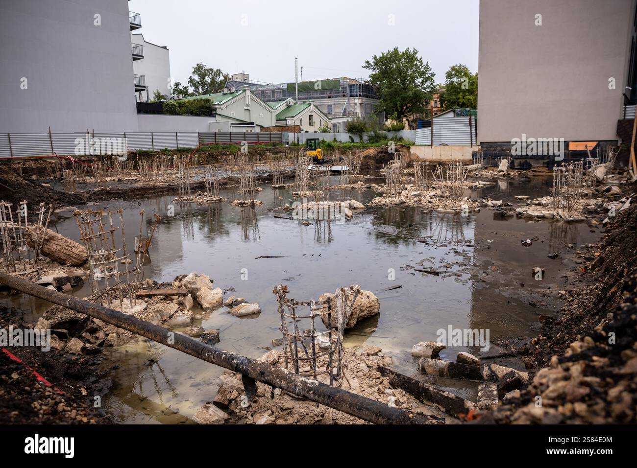 Construction site in an urban area with water filled foundation ...