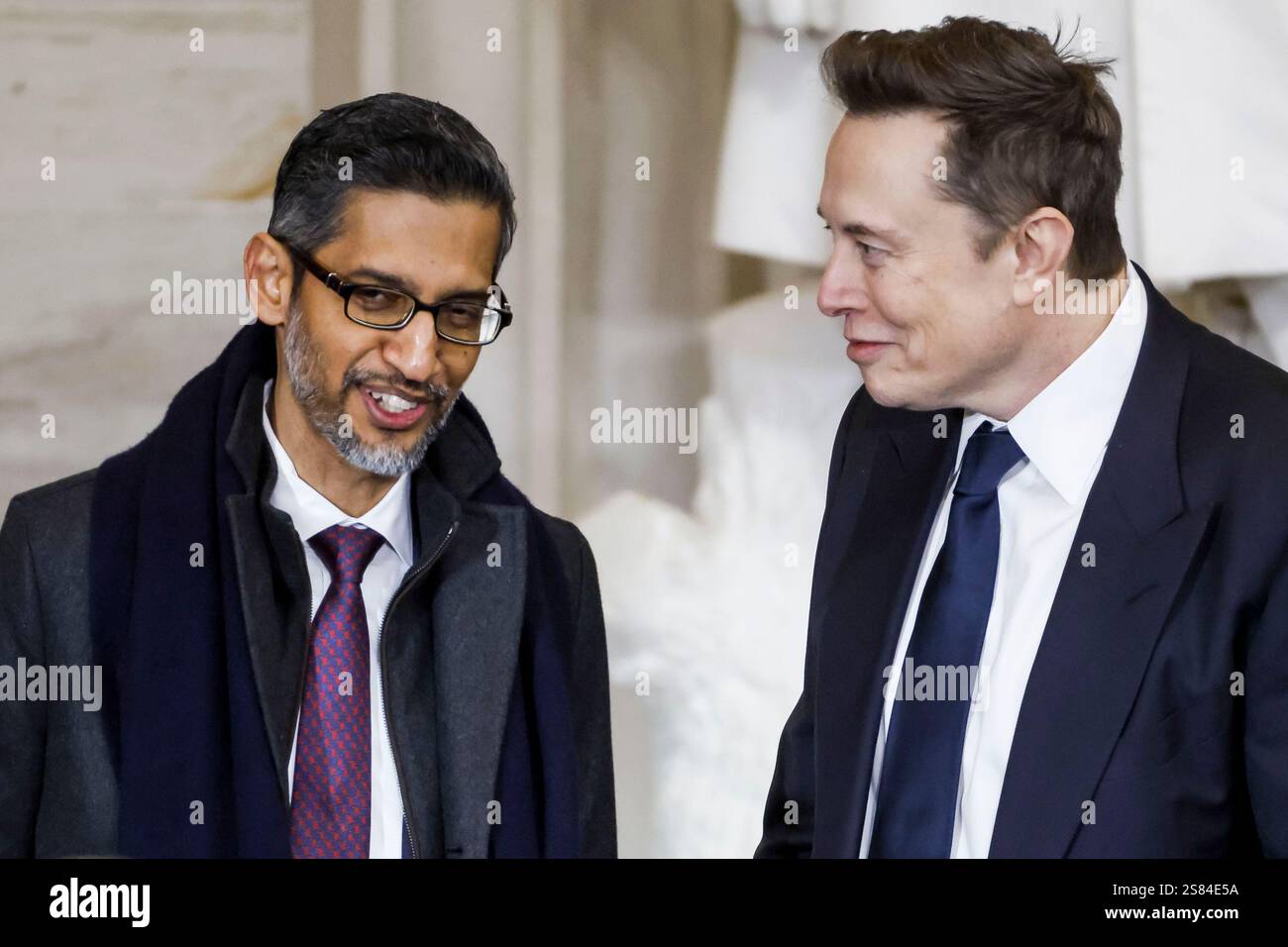 Alphabet’s CEO Sundar Pichai (L) and businessman Elon Musk (R) attend ...