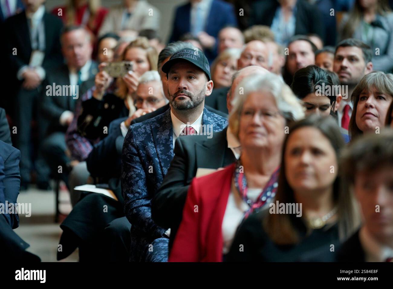 An attendee is seen in an overflow room for President-elect Donald ...