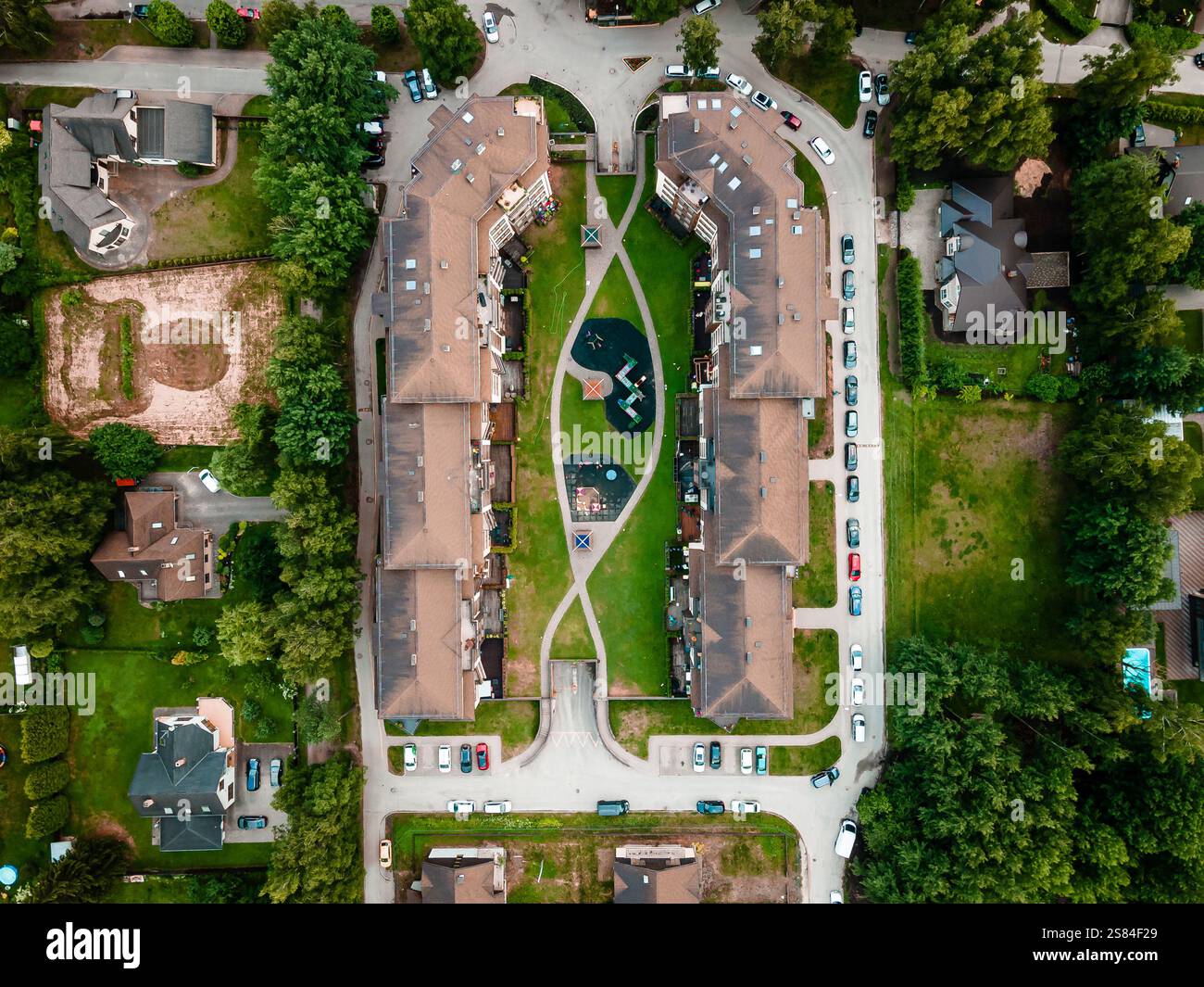 Aerial perspective of a residential complex with parallel multi story ...