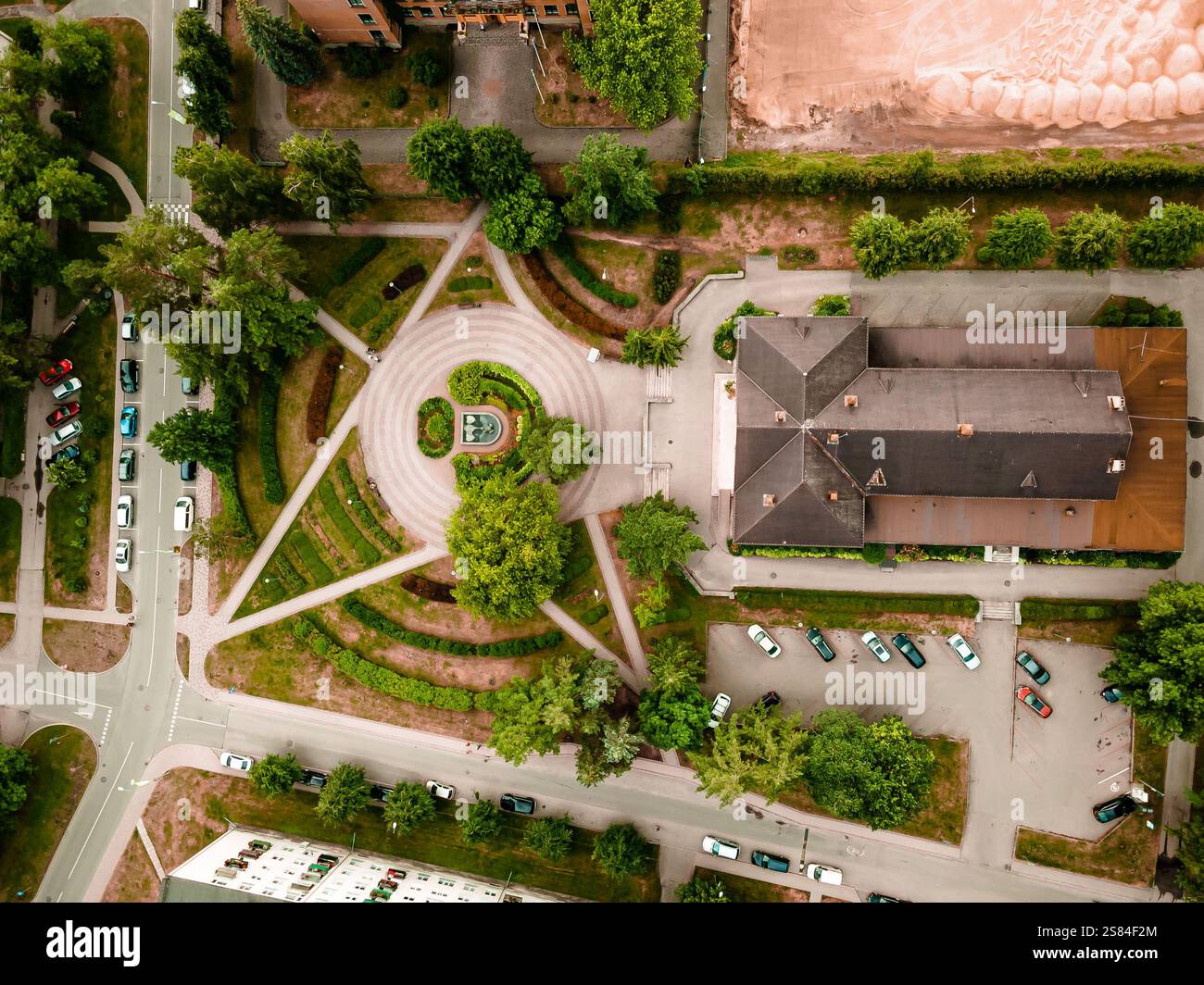 Aerial perspective of a park with a circular plaza, star shaped ...