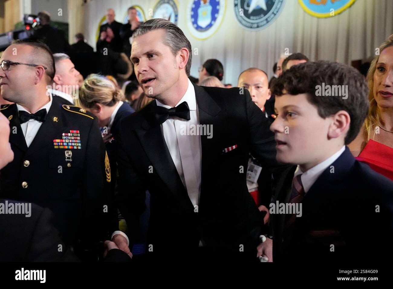 Defense Secretary nominee Pete Hegseth, center, attends the Commander ...