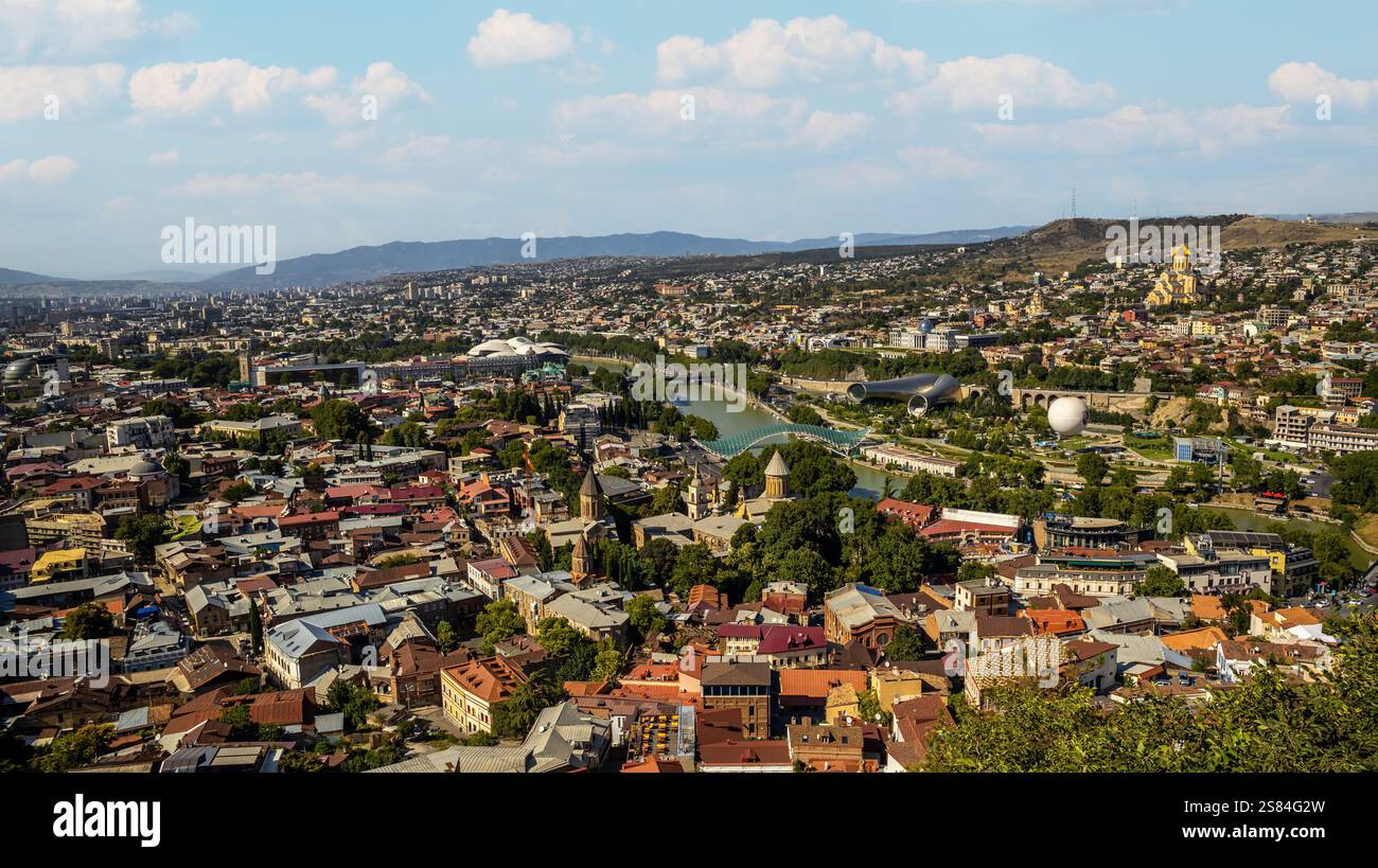 Tbilisi cityscape with the Kura River, Holy Trinity Cathedral's golden ...