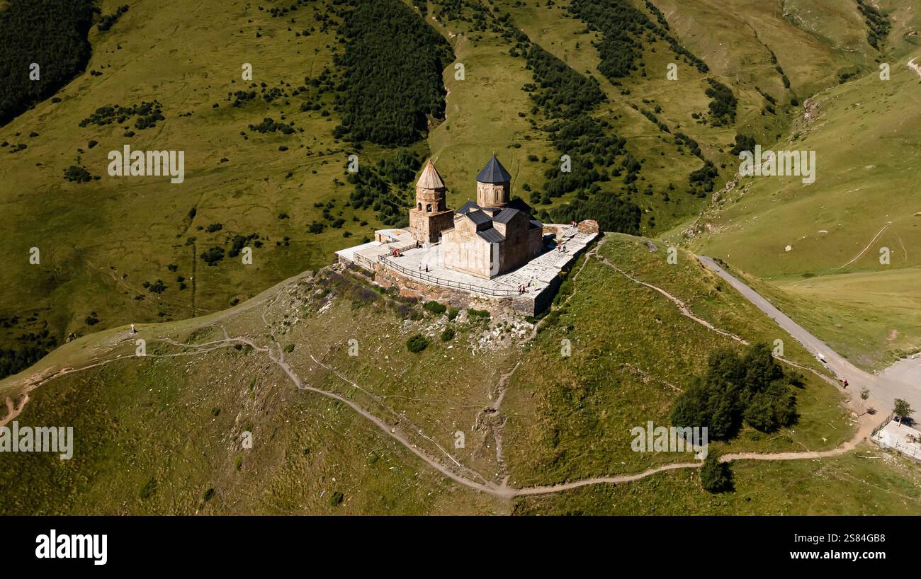 Gergeti Trinity Church, a 14th century stone structure with bell tower ...