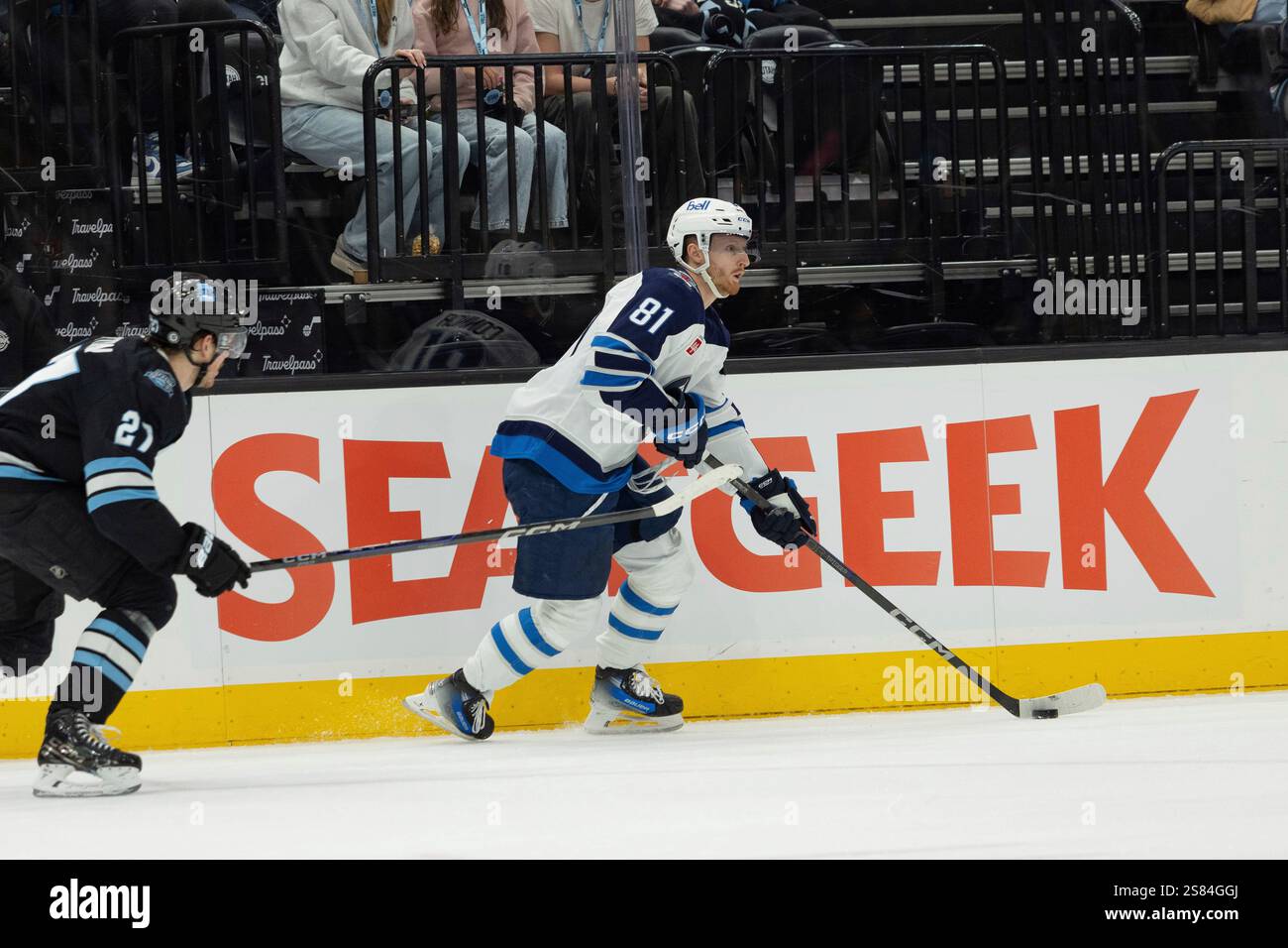 Winnipeg Jets left wing Kyle Connor (81) moves the puck against Utah ...
