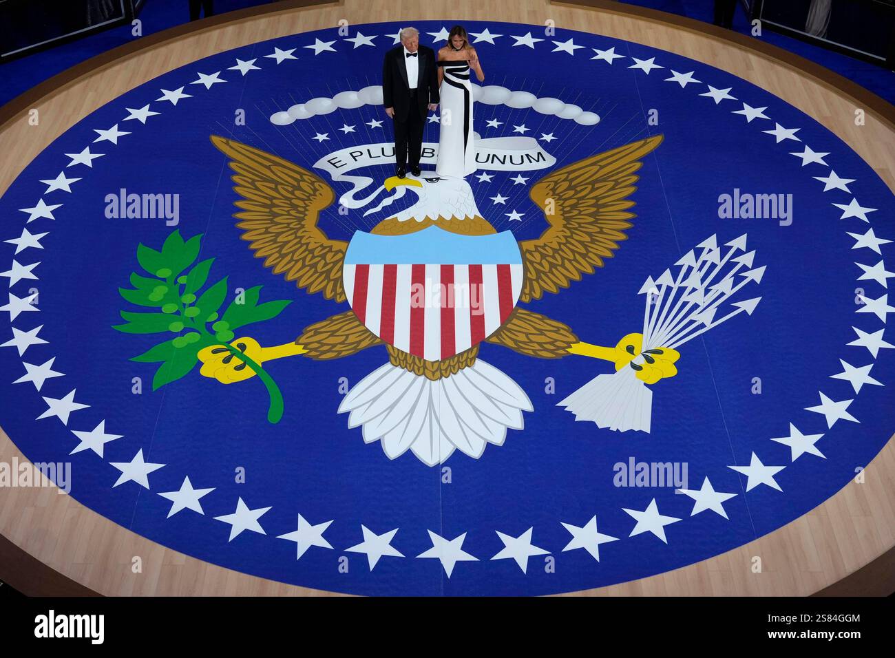 President Donald Trump, left, and first lady Melania Trump stand before ...