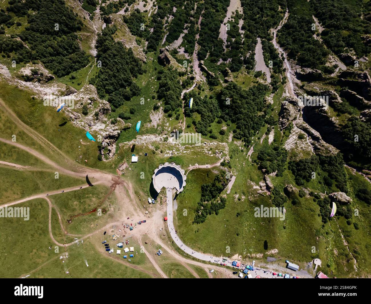 Aerial view of a circular monument in Georgia, surrounded by rugged ...