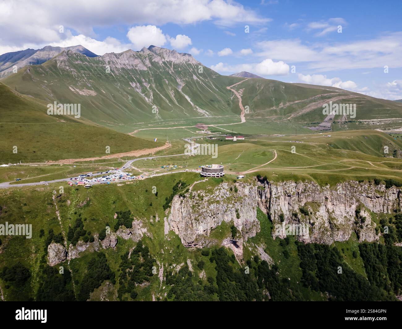 Circular Friendship Monument on a cliff in Kazbegi, Georgia, surrounded ...