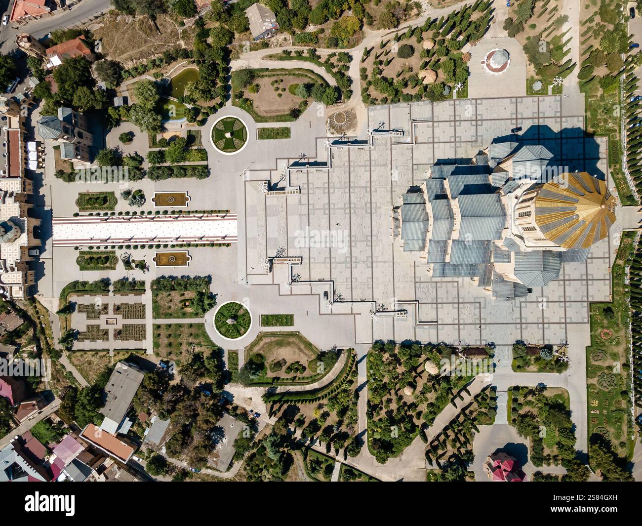 Golden domed Holy Trinity Cathedral of Tbilisi with landscaped gardens ...