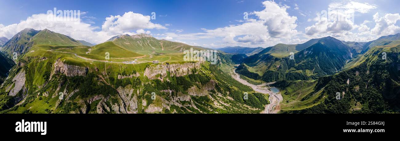 The Caucasus Mountains in Georgia feature cliffs, green hills, rugged ...