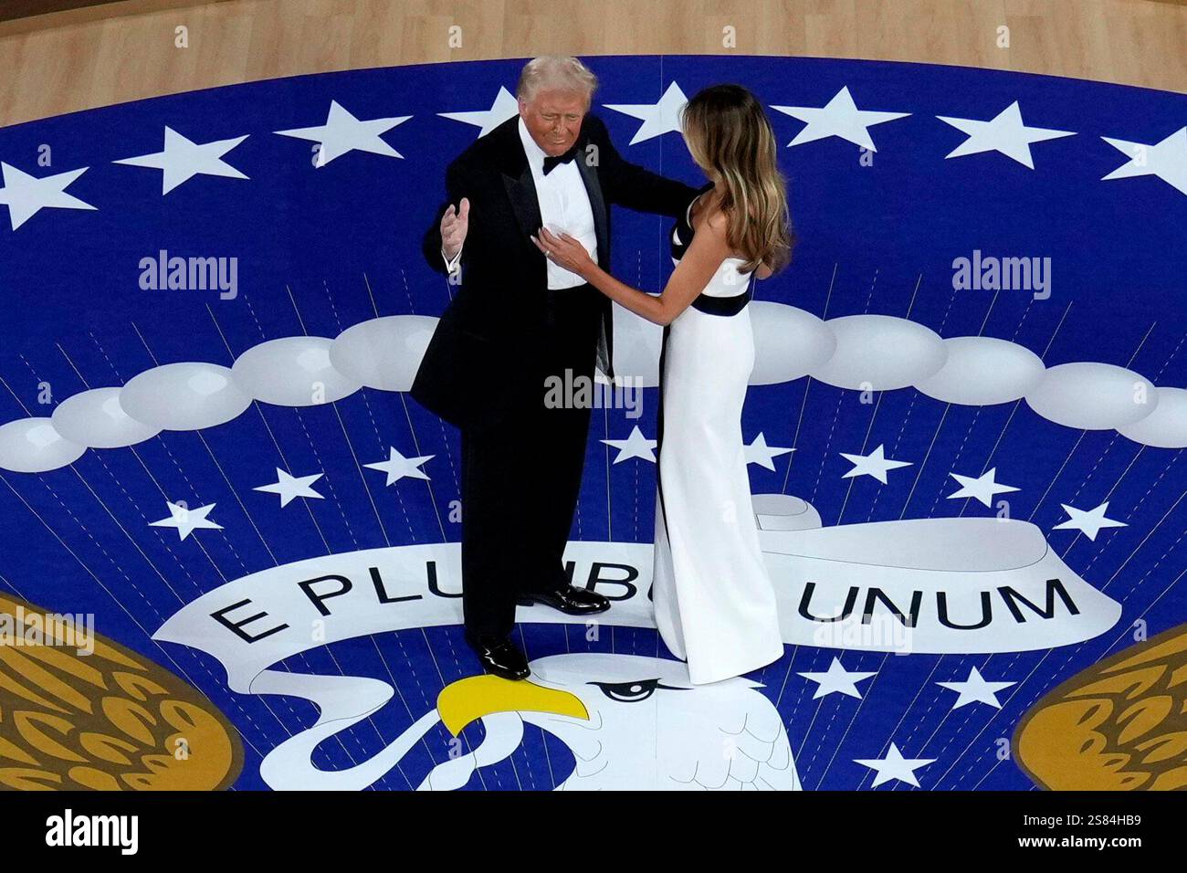 President Donald Trump, left, and first lady Melania Trump dance at the Commander in Chief Ball ...