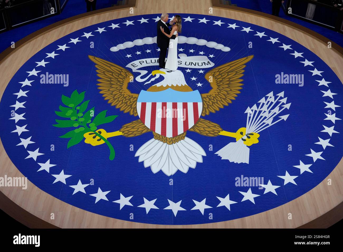 President Donald Trump, left, and first lady Melania Trump dance at the ...