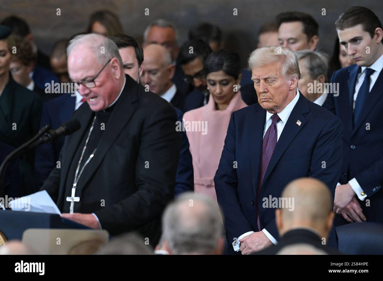 Archbishop of New York Cardinal Timothy Dolan (L) delivers the ...