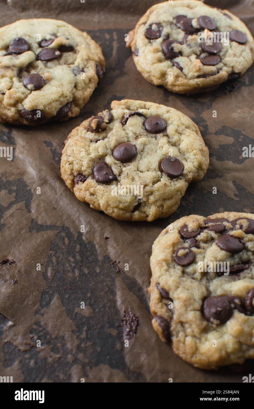 Overhead view of Large homemade chocolate chip cookies on a lined ...