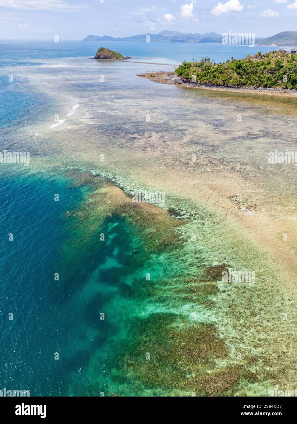 Aerial view of the Mayotte lagoon with visible coral reef flats and the ...