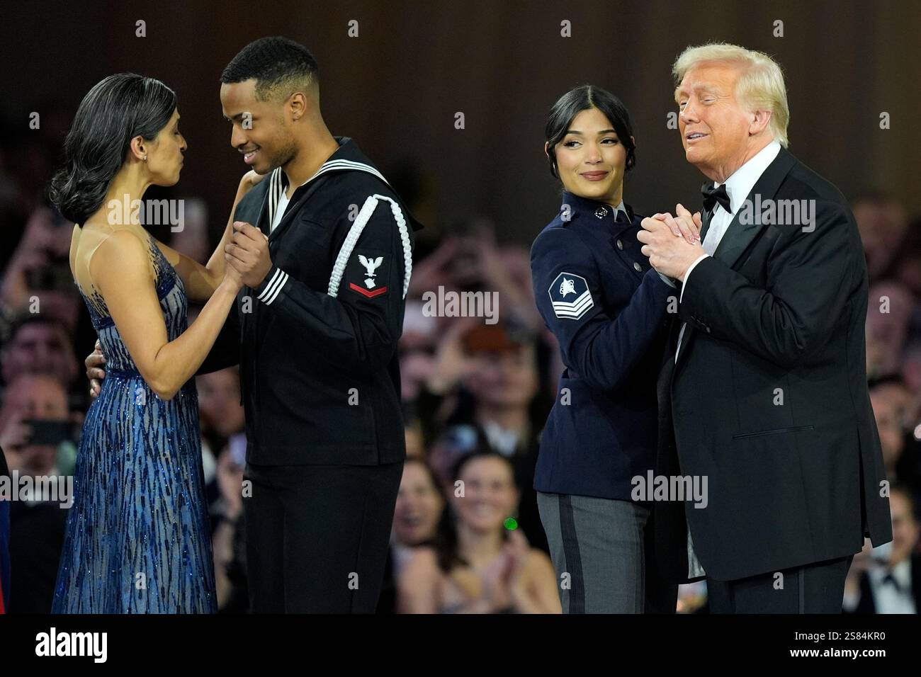 President Donald Trump, right, and Usha Vance, left, dance with members ...