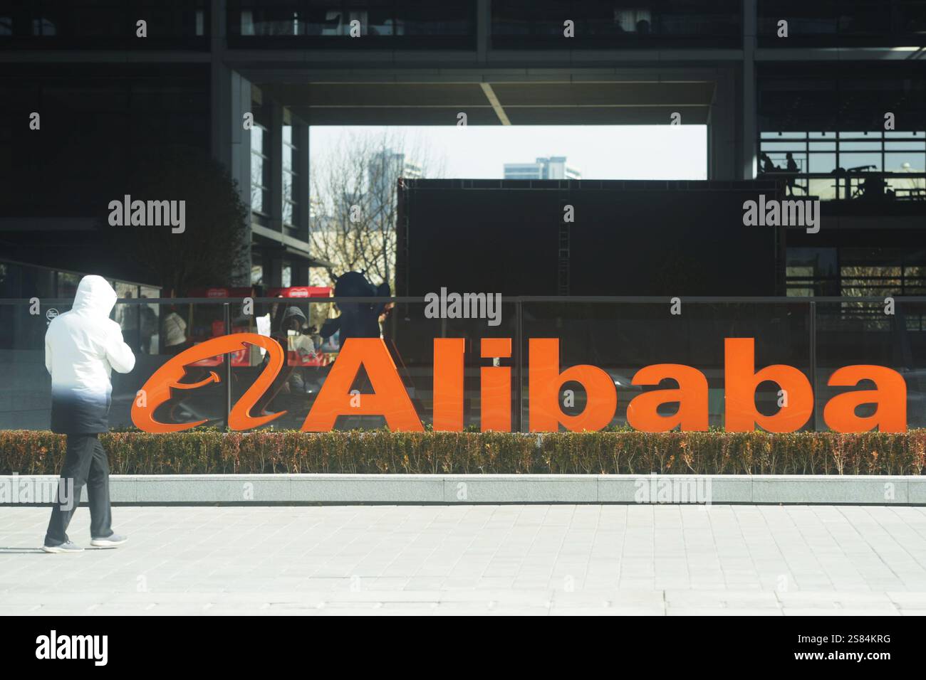SHANGHAI, CHINA - JANUARY 16, 2025 - A citizen walks past Alibaba's ...