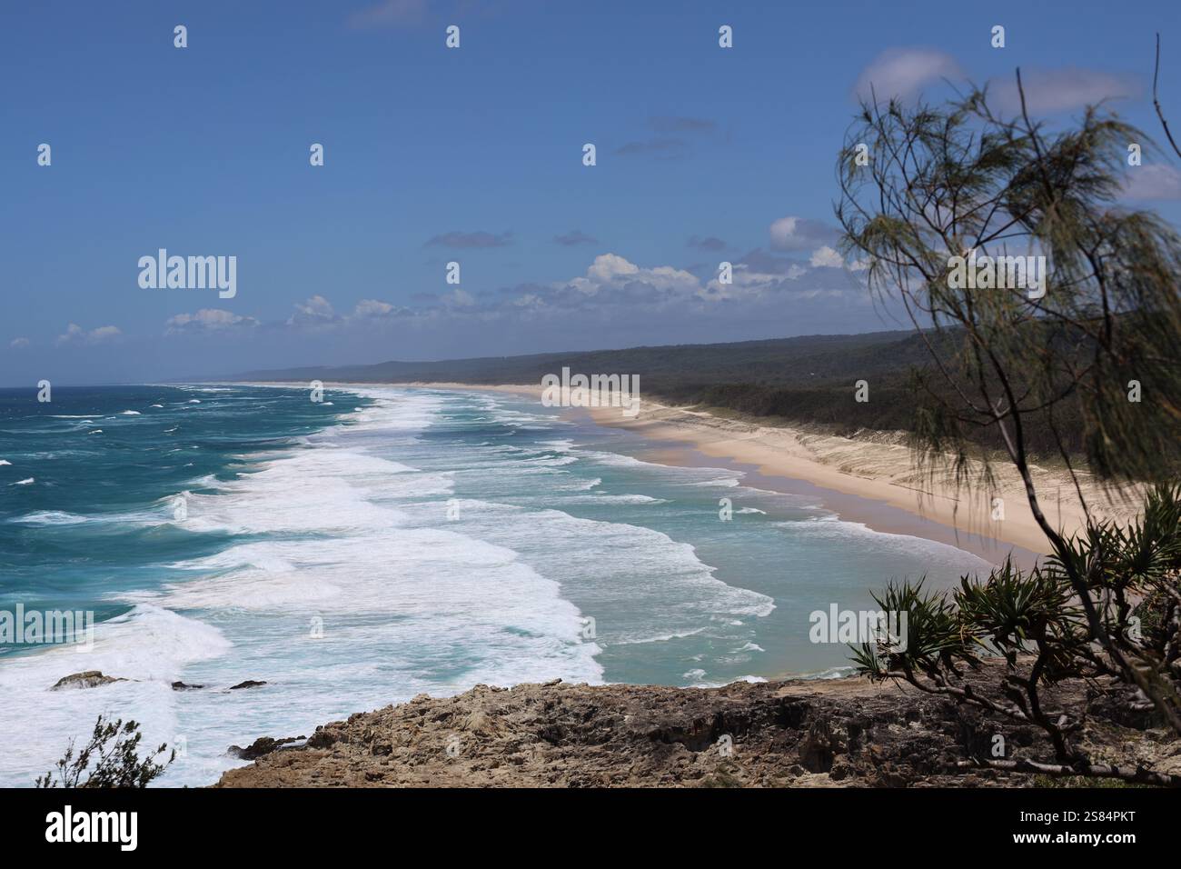 three tiers of waves washing ashore on an endless beach under endless ...