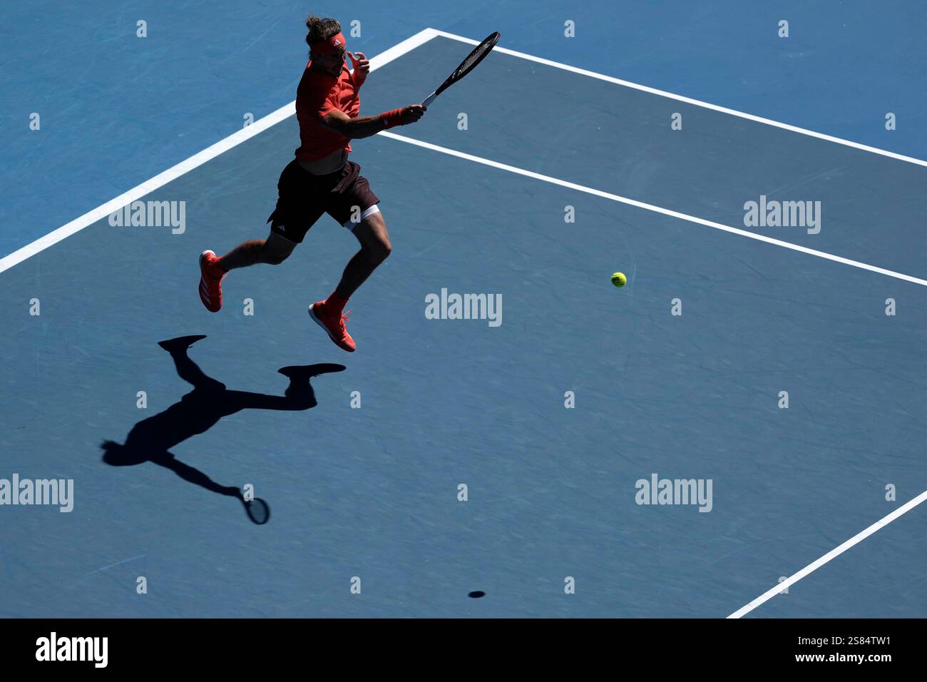 Alexander Zverev of Germany plays a forehand return to Tommy Paul of ...