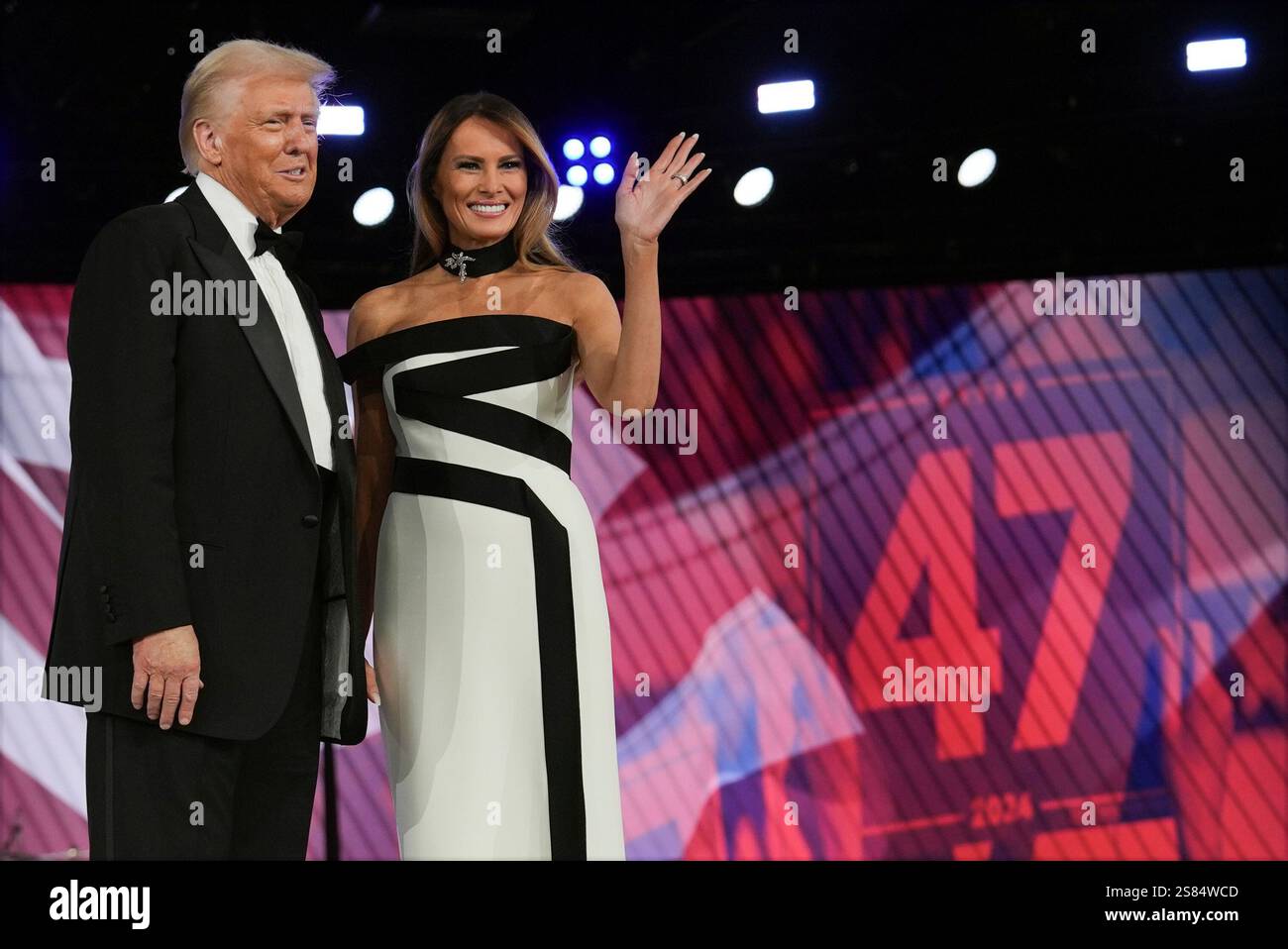 President Donald Trump and first lady Melania Trump wave after dancing ...