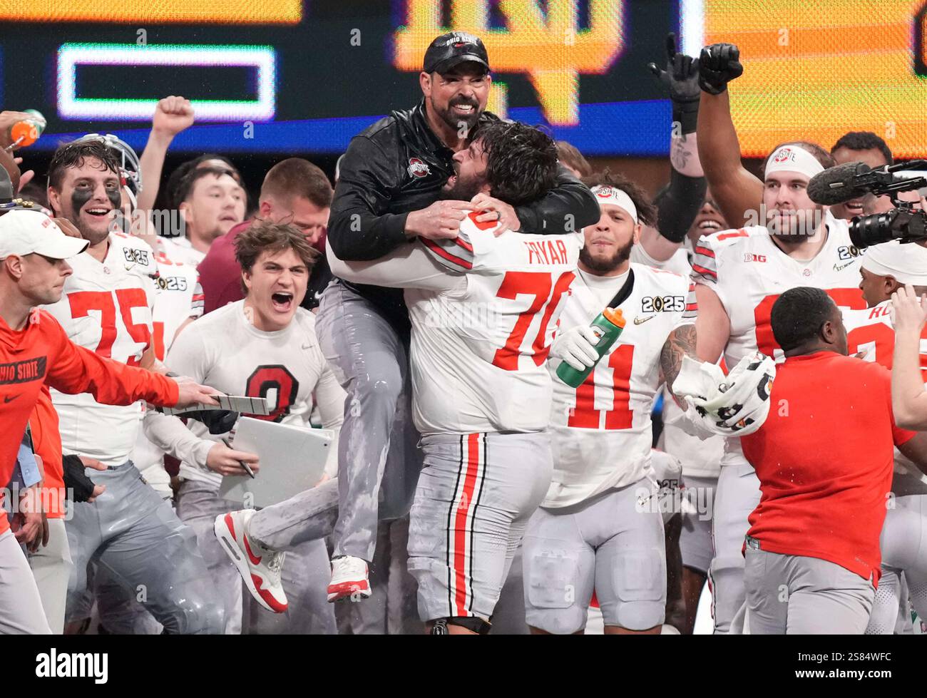 Atlanta, United States. 20th Jan, 2025. Players dump a bucket of ...