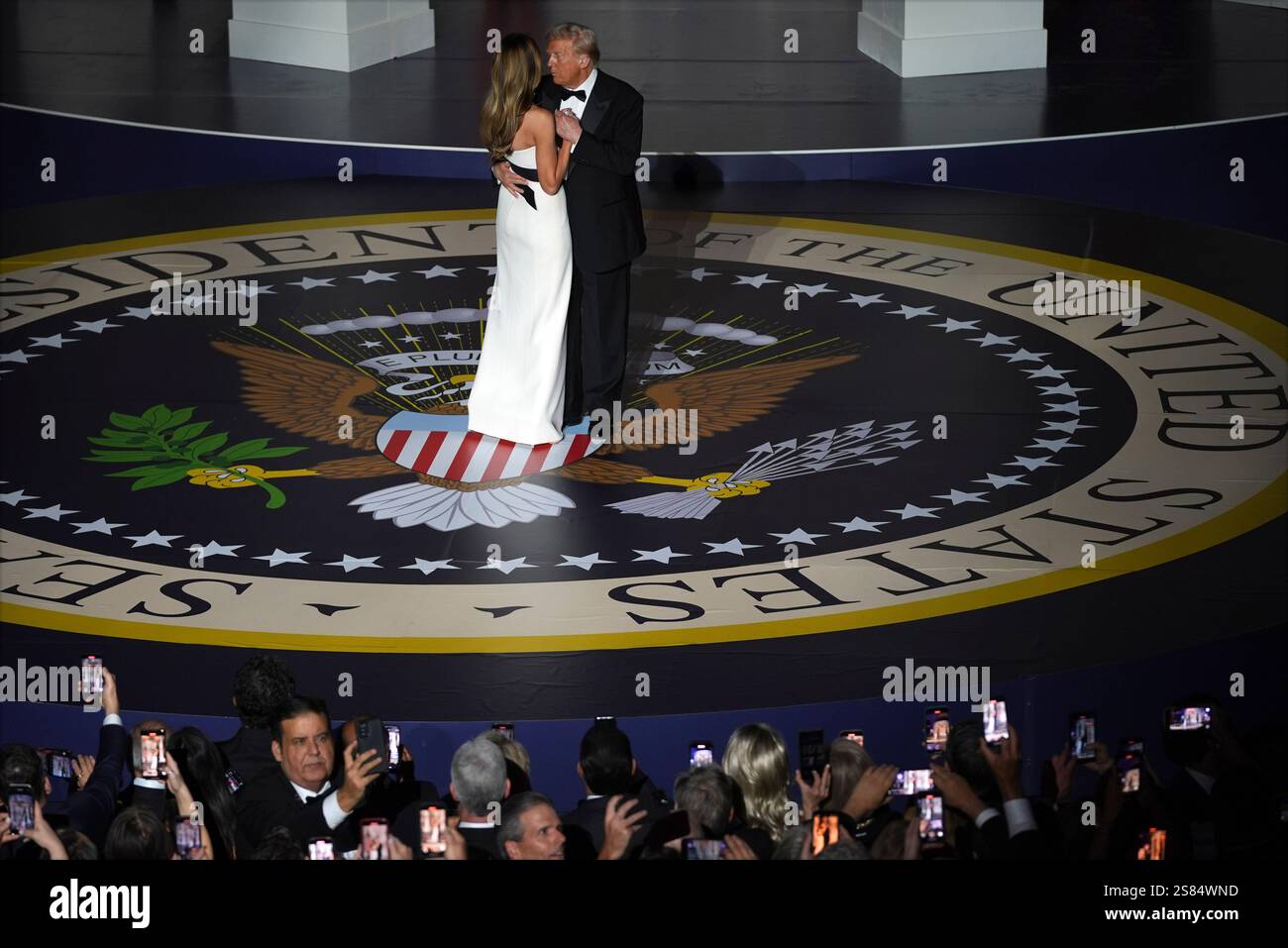 President Donald Trump and first lady Melania Trump dance at the ...