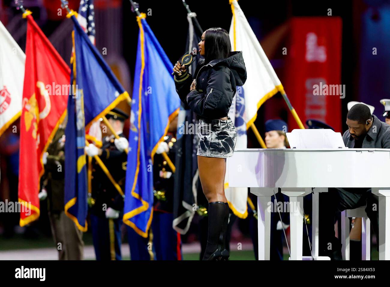 ATLANTA, GA - JANUARY 20: Coco Jones sings the national anthem before ...