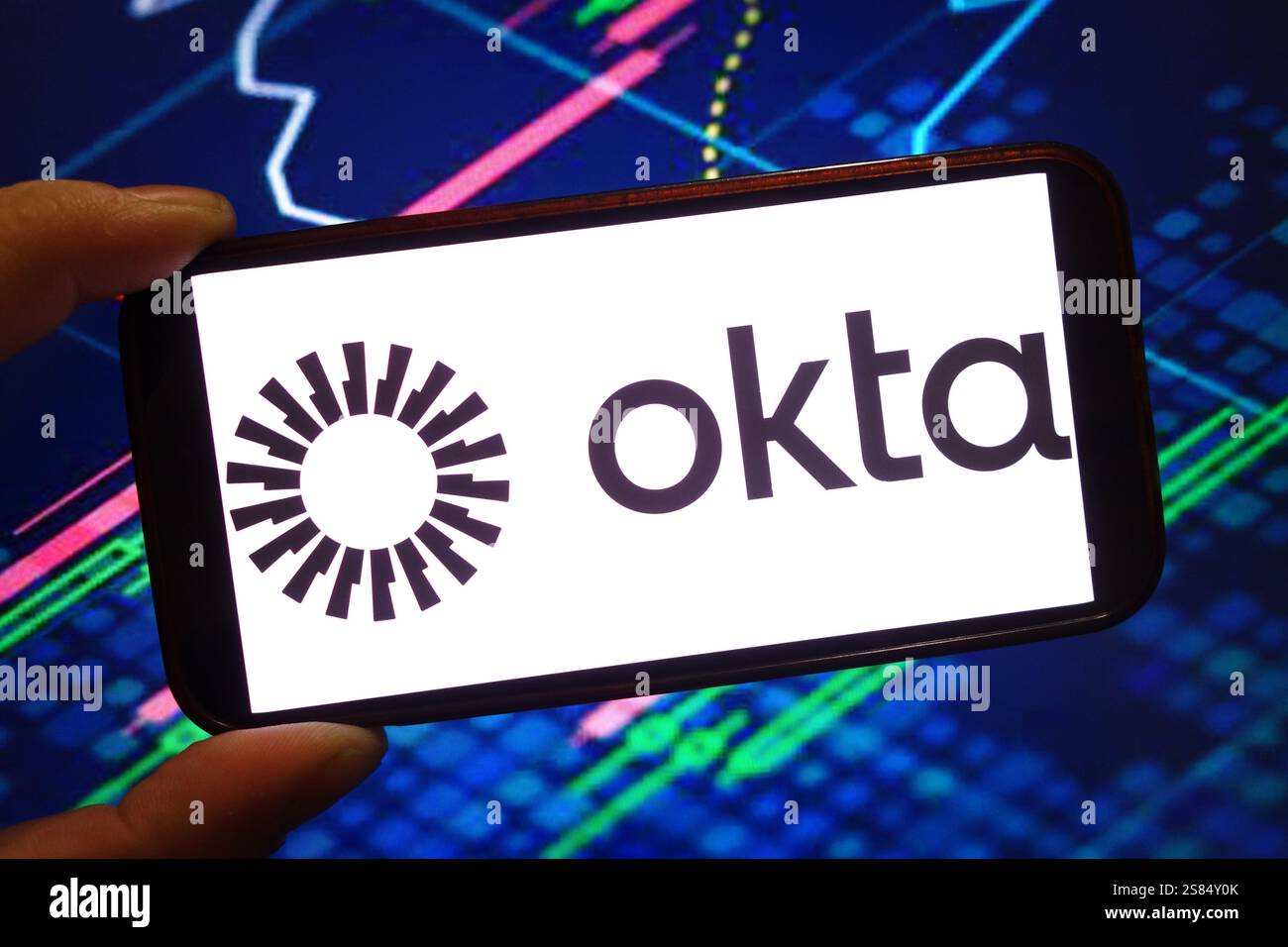 In this photo illustration, the Okta Inc company logo is seen displayed ...