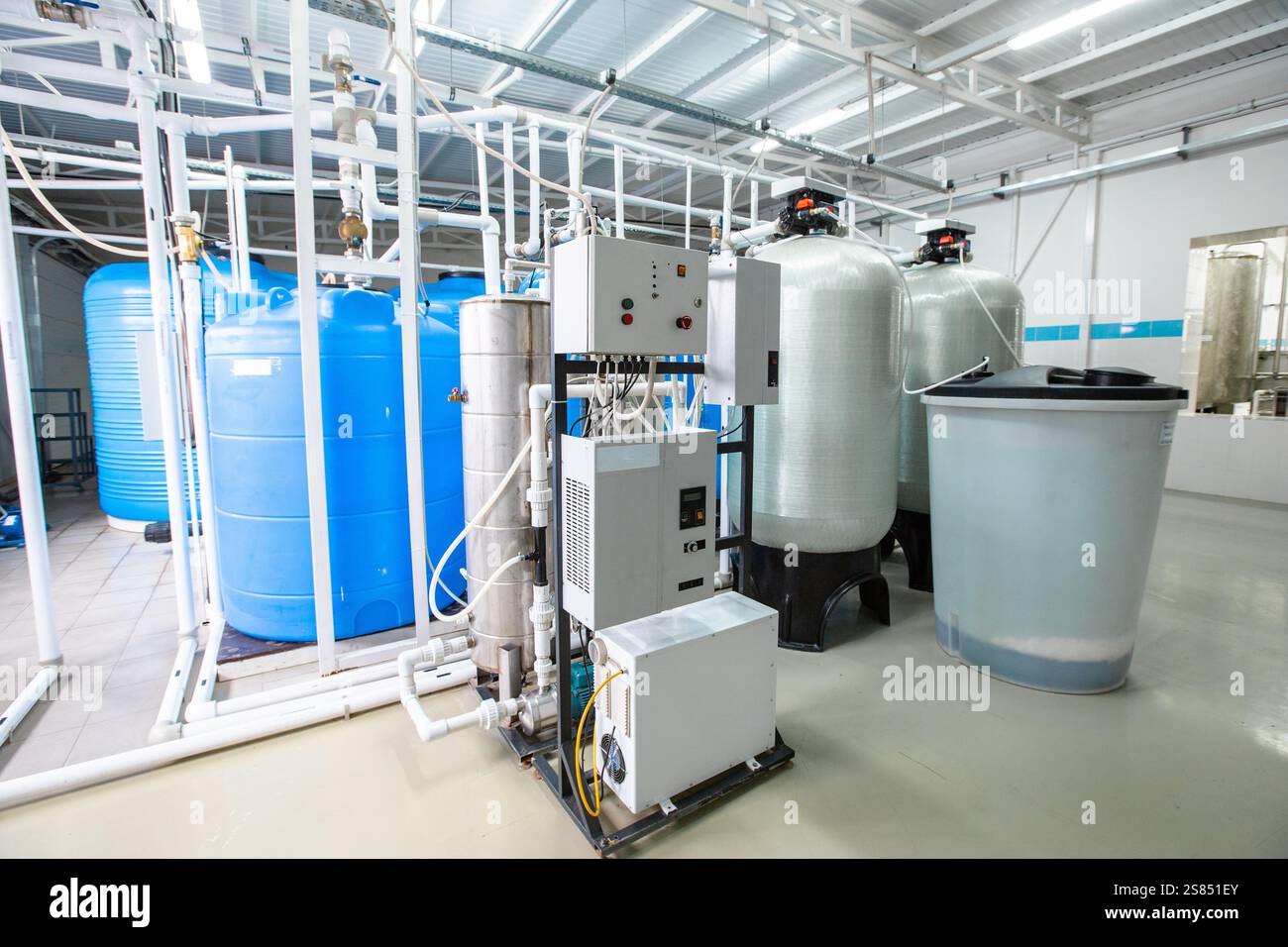 Industrial water treatment facility featuring large storage tanks and ...