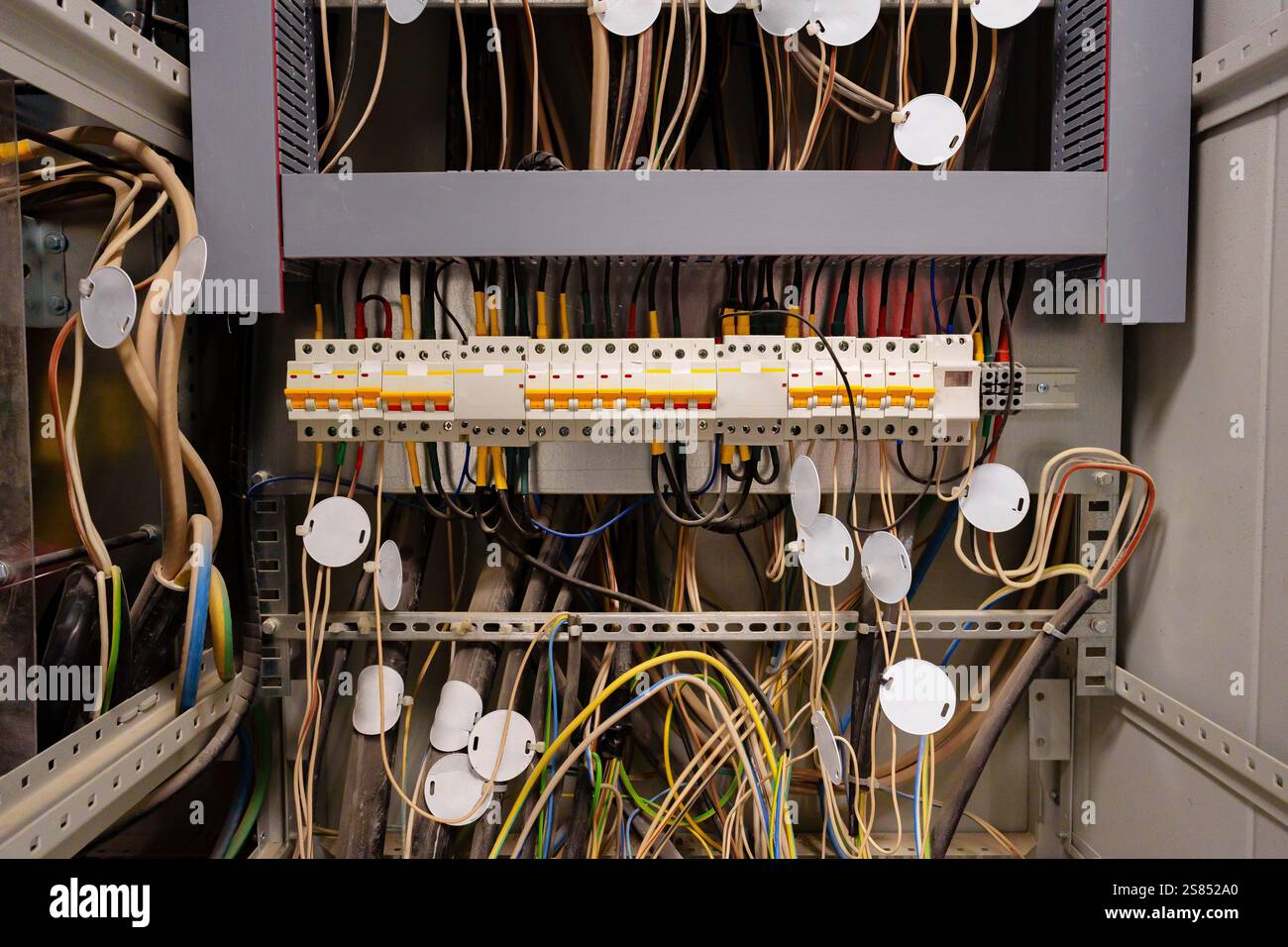 Close view of complex electrical wiring in a control panel at a ...